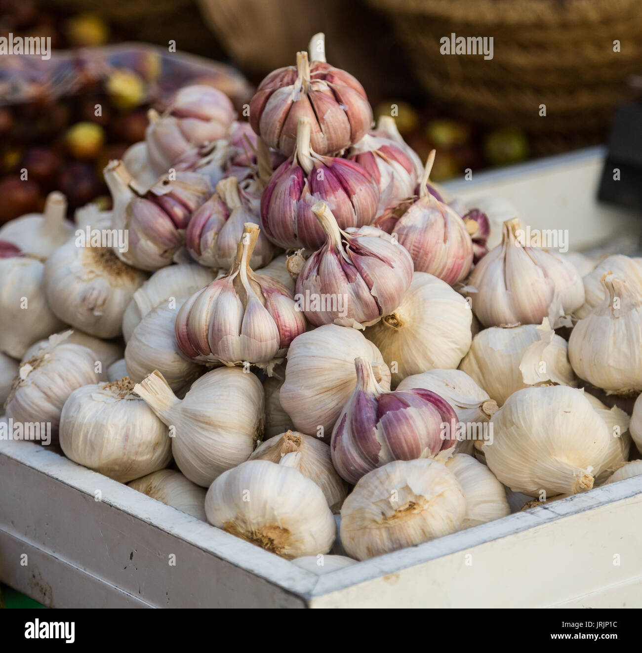Many Garlic Cloves in Market Stock Photo - Alamy