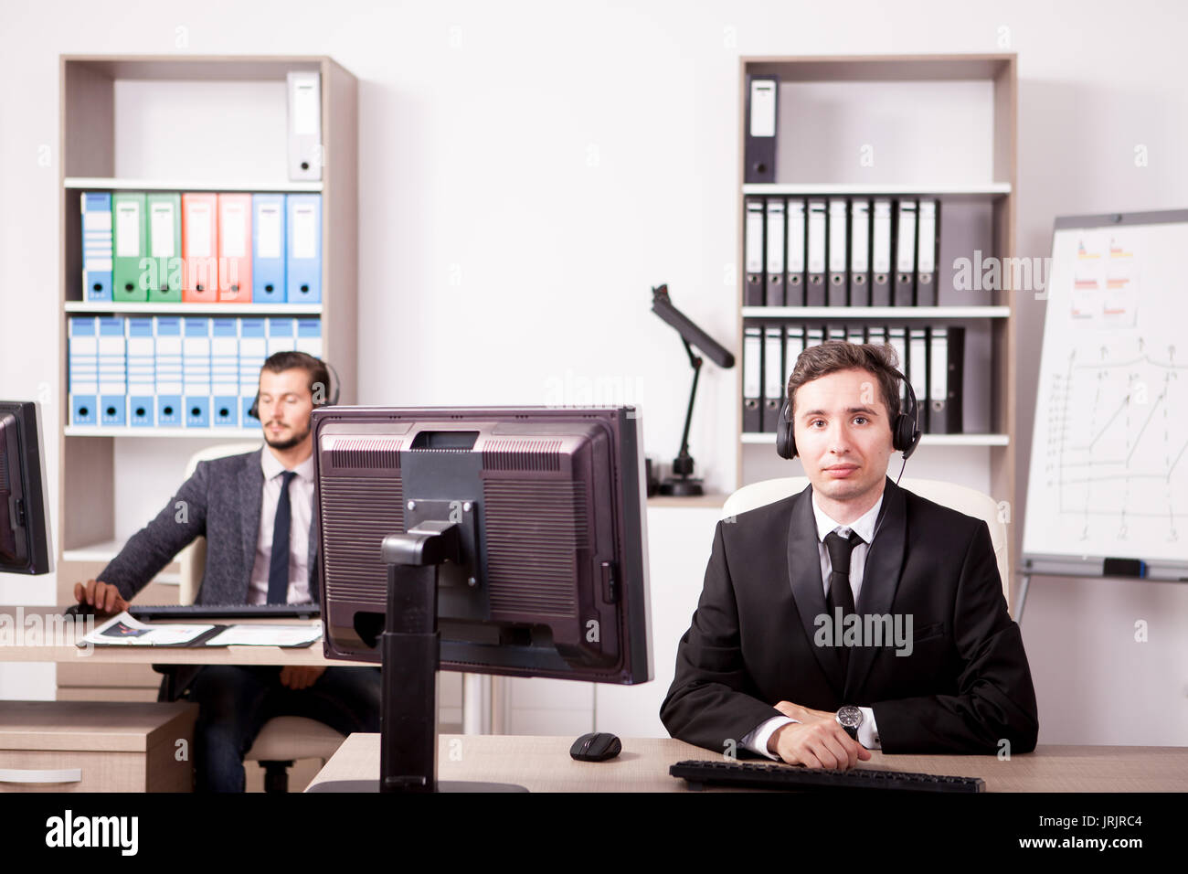 Customer service support working in the office Stock Photo - Alamy
