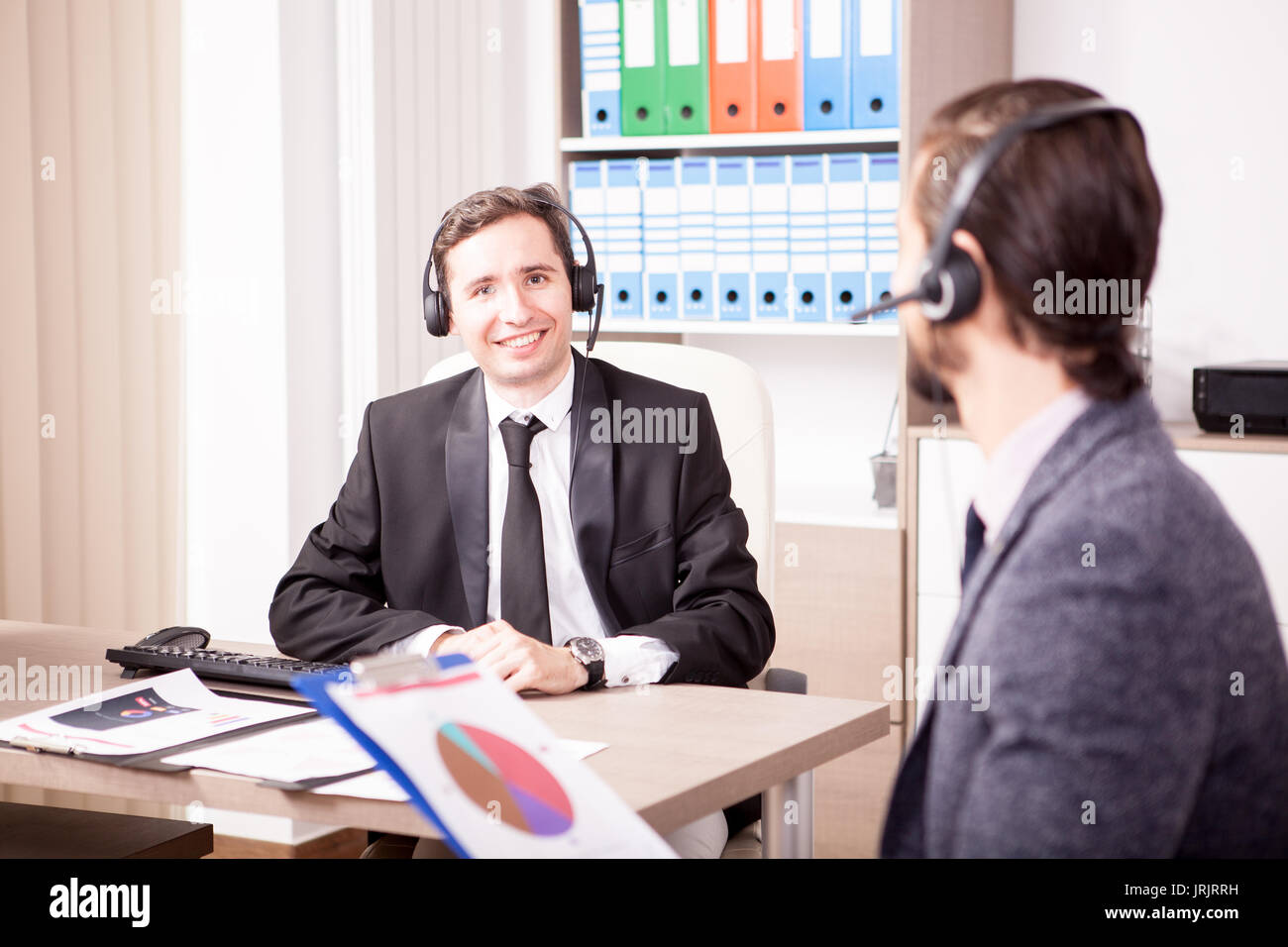 Customer service support working in the office Stock Photo - Alamy