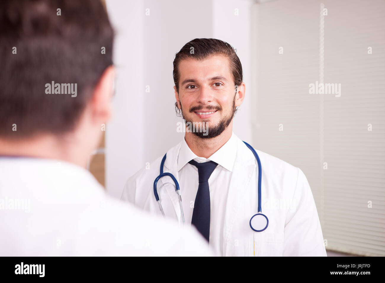 Doctors talking each other hi-res stock photography and images - Alamy