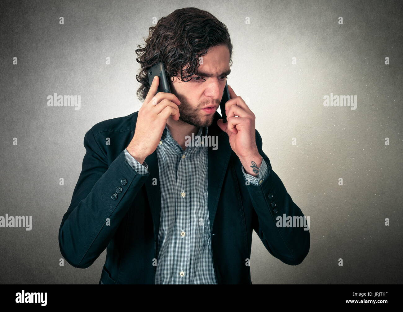 Angry man on the phones Stock Photo - Alamy