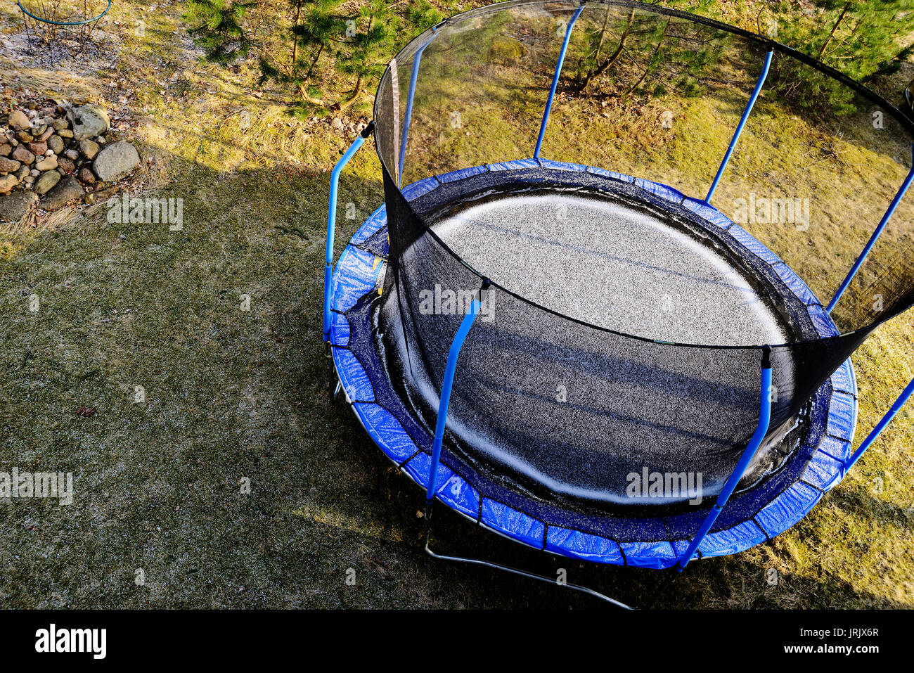trampoline on a lawn covered with snow, view from above Stock Photo - Alamy