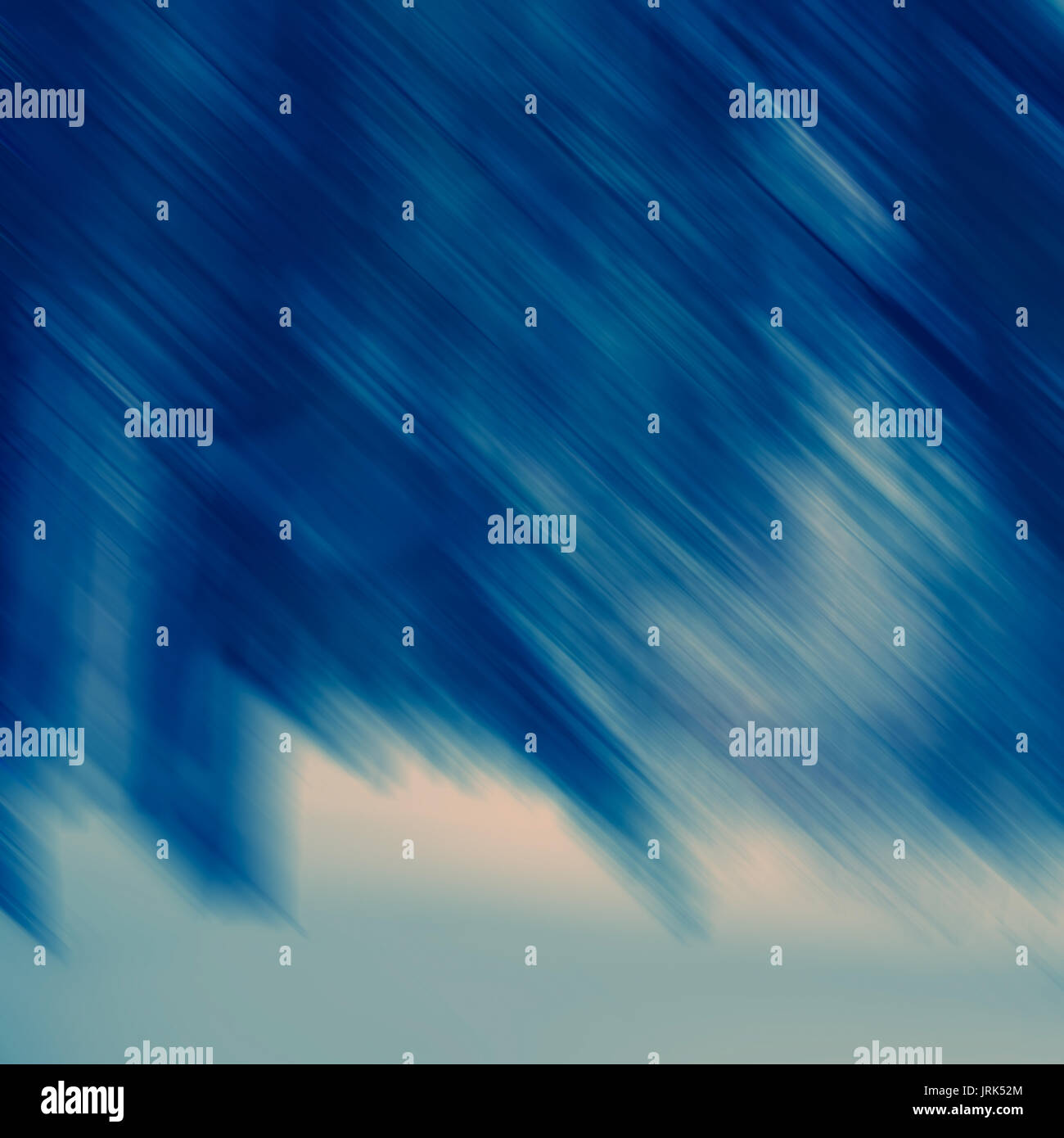 Abstract diagonal spots and lines in blue tonality, blurred background ...