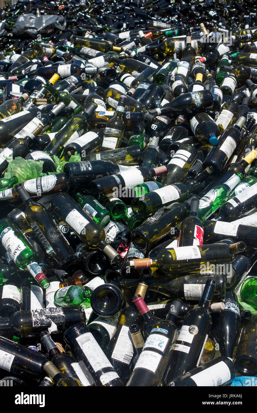 Piles of glass ready for recycling at a traditional glass blowing ...