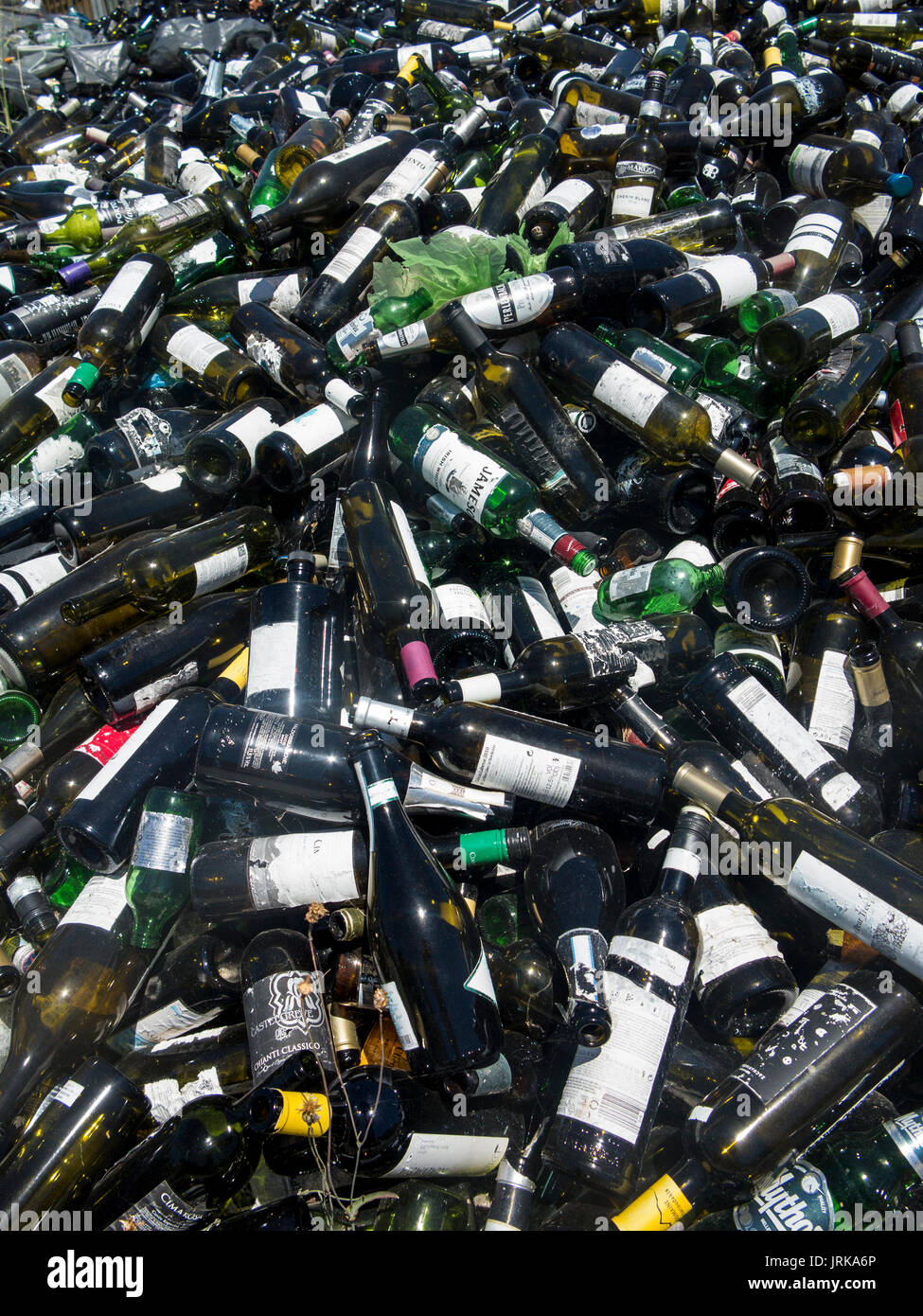 Piles of glass ready for recycling at a traditional glass blowing ...