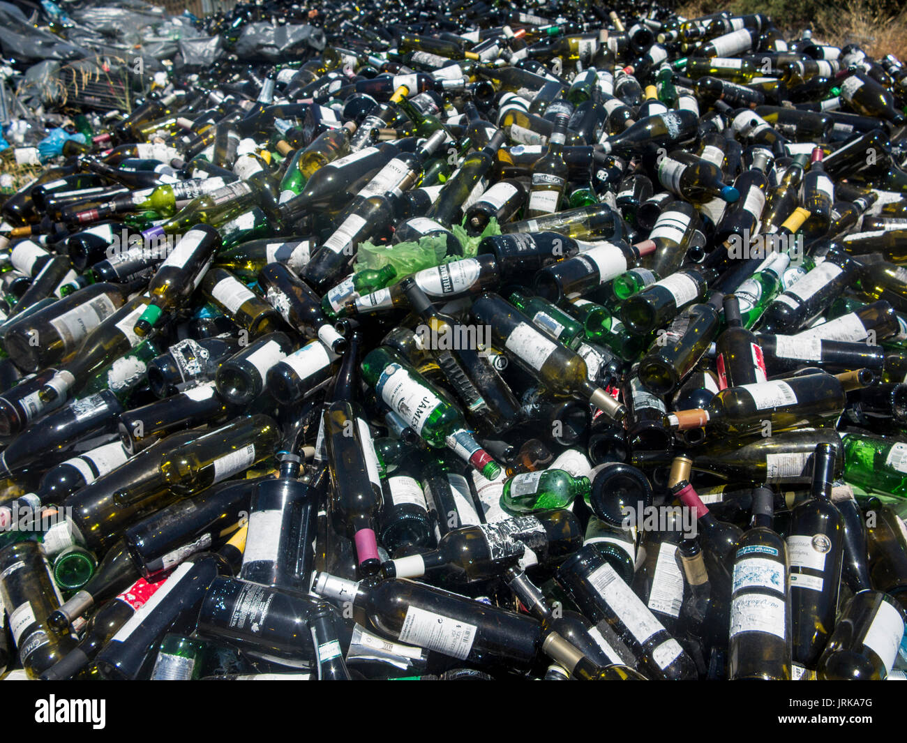 Piles of glass ready for recycling at a traditional glass blowing ...