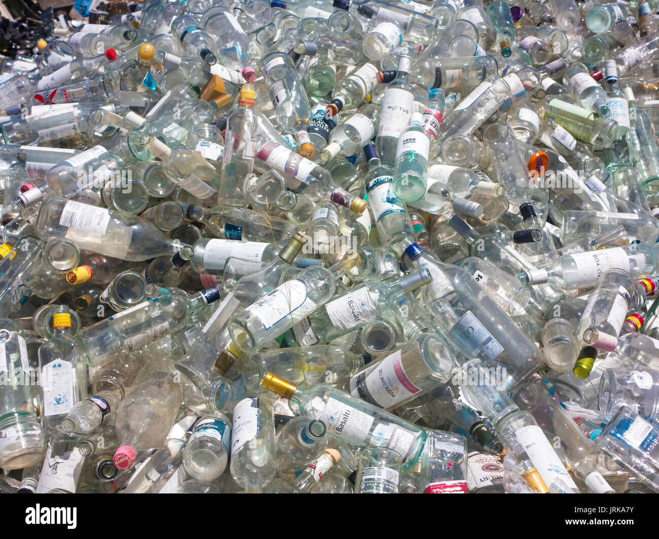 Piles of glass ready for recycling at a traditional glass blowing ...