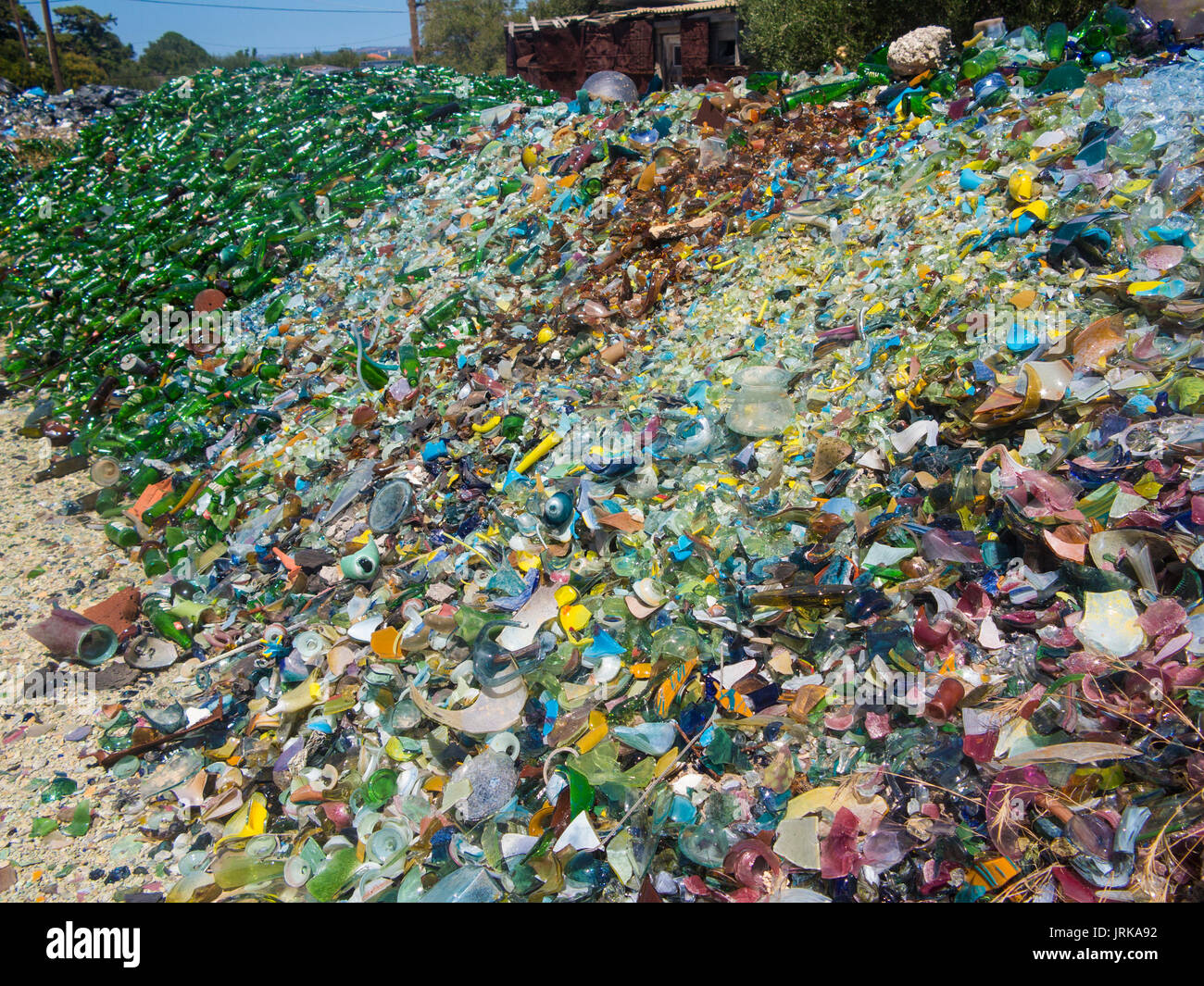 Piles of glass ready for recycling at a traditional glass blowing ...