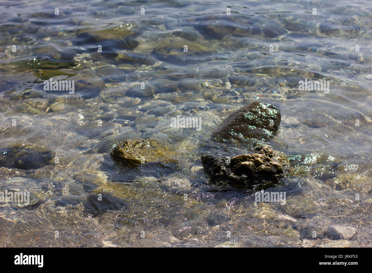 Stones on the beach at the sea under water Stock Photo - Alamy