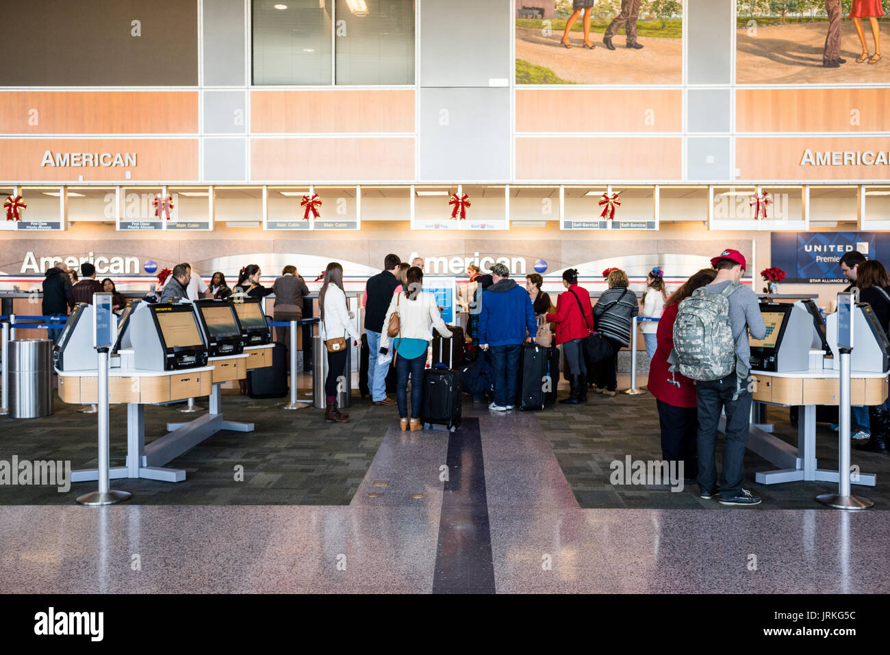 Passengers using the United airlines auto check-in stations at Austin ...