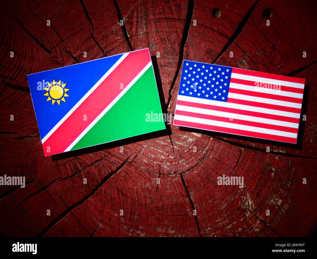 Namibian flag with USA flag on a tree stump isolated Stock Photo - Alamy