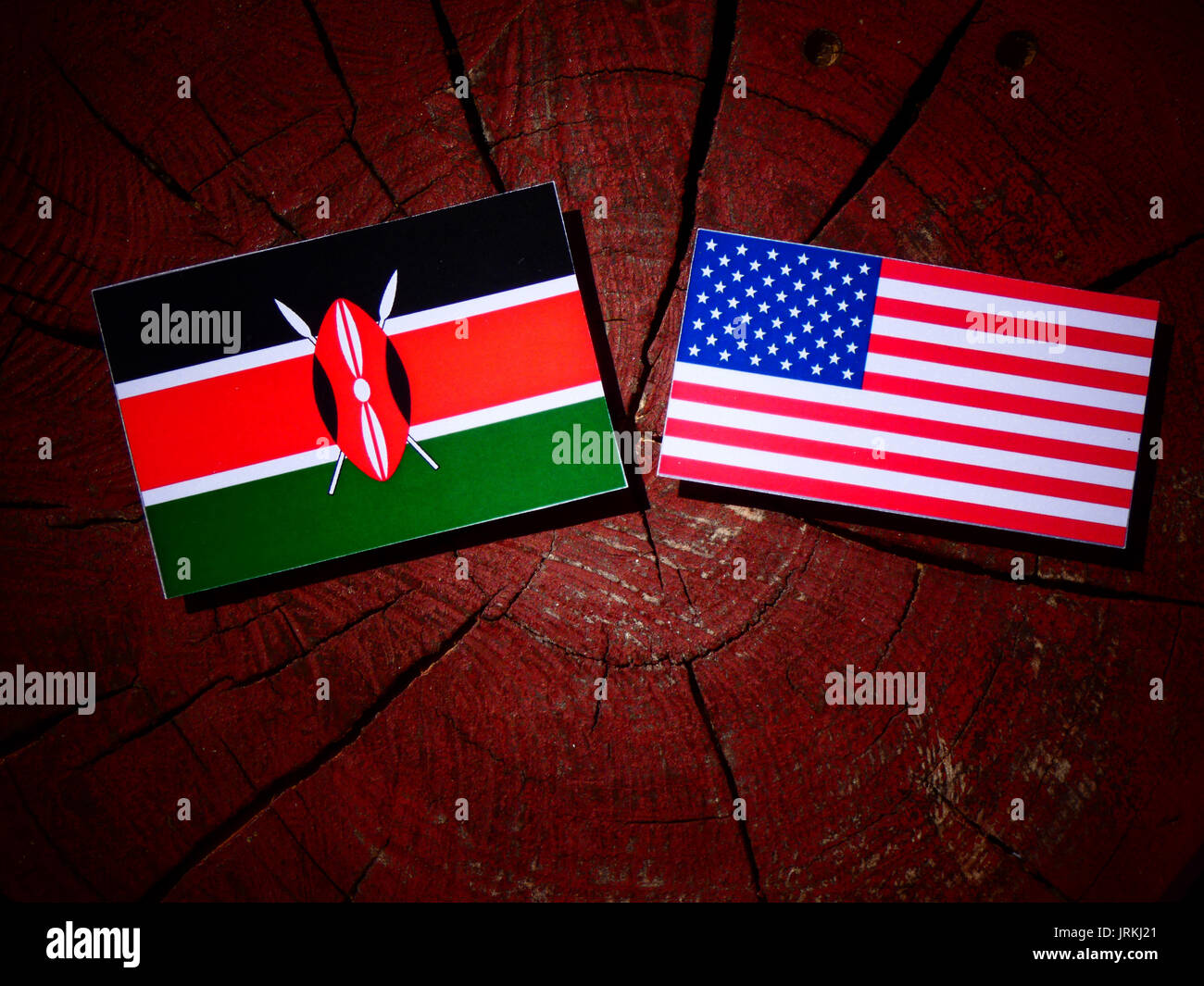 Kenyan flag with USA flag on a tree stump isolated Stock Photo - Alamy