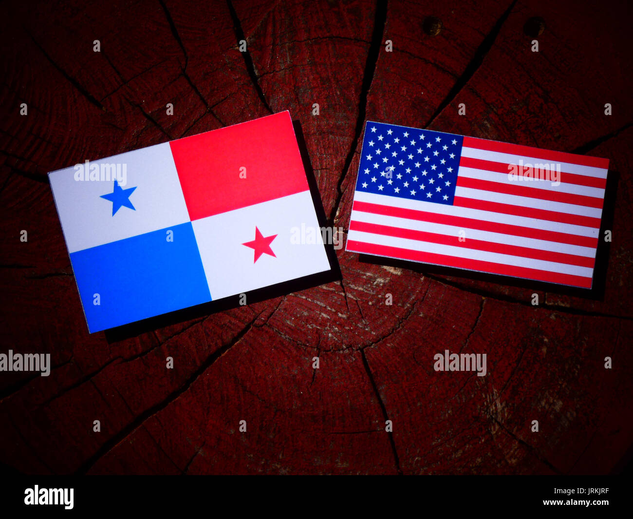 Panamanian flag with USA flag on a tree stump isolated Stock Photo - Alamy