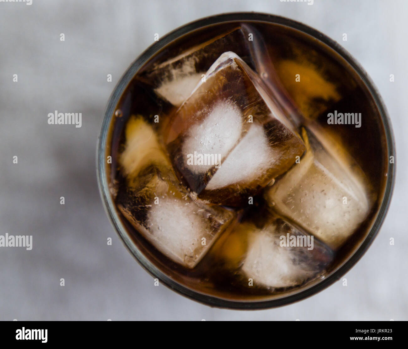 cola, soda in glass with big ice cubes Stock Photo - Alamy