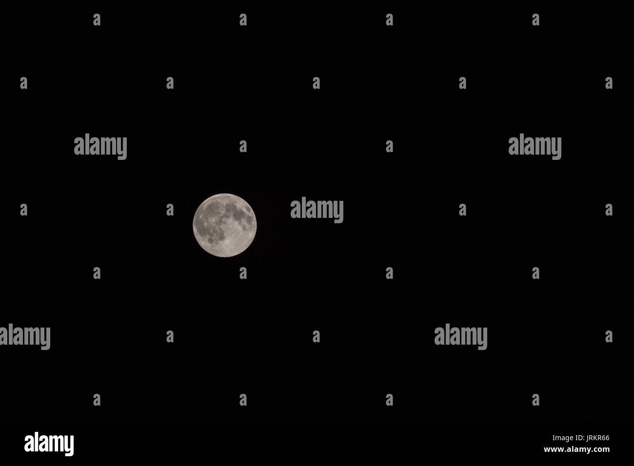 The silver full moon isolated on black Stock Photo - Alamy