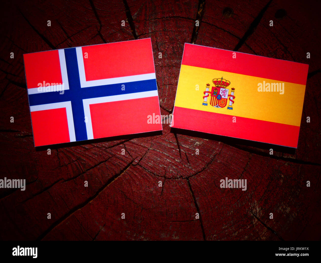 Norwegian flag with Spanish flag on a tree stump isolated Stock Photo ...