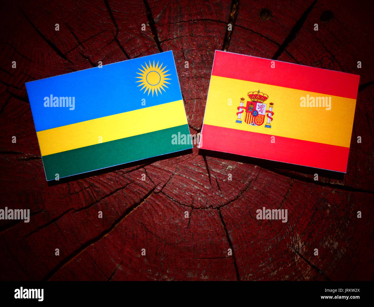 Rwanda flag with Spanish flag on a tree stump isolated Stock Photo - Alamy