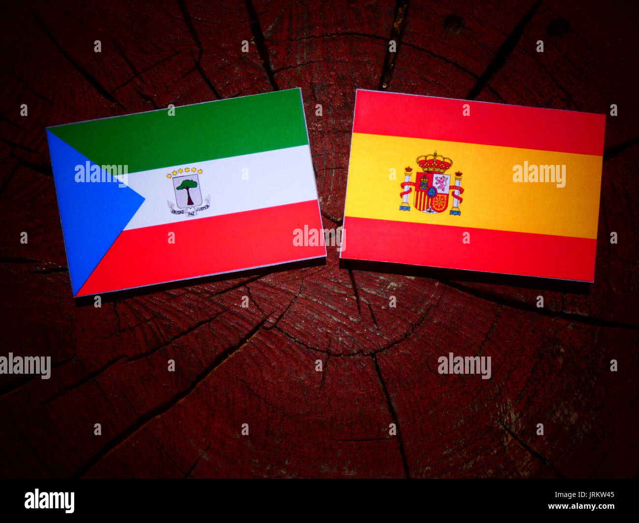 Equatorial Guinea flag with Spanish flag on a tree stump isolated Stock ...