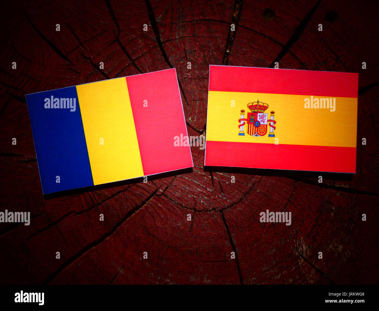 Chad flag with Spanish flag on a tree stump isolated Stock Photo - Alamy