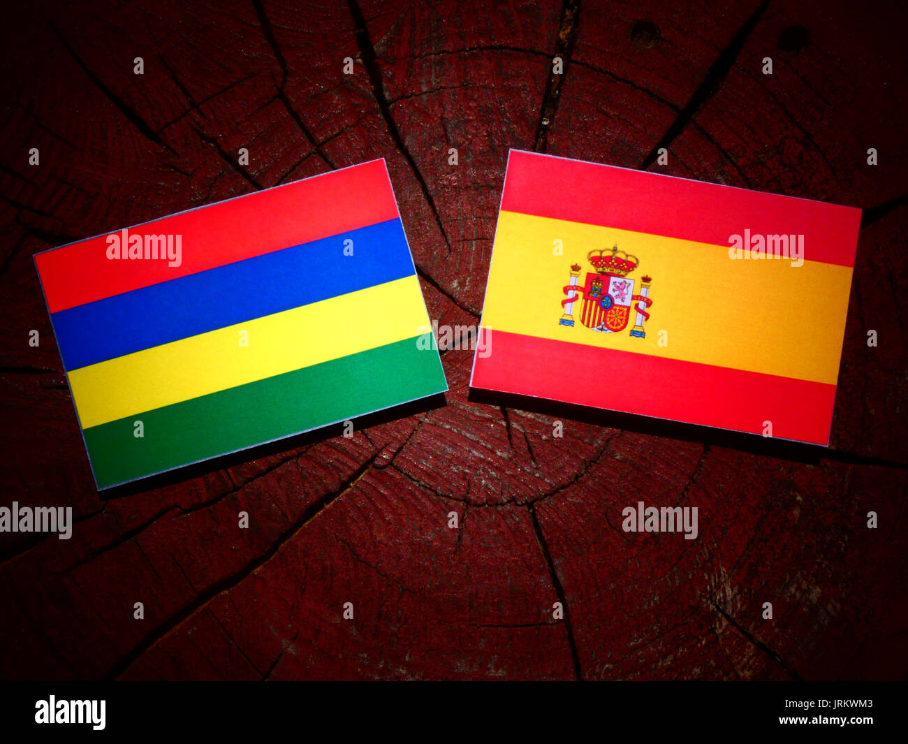 Mauritius flag with Spanish flag on a tree stump isolated Stock Photo ...