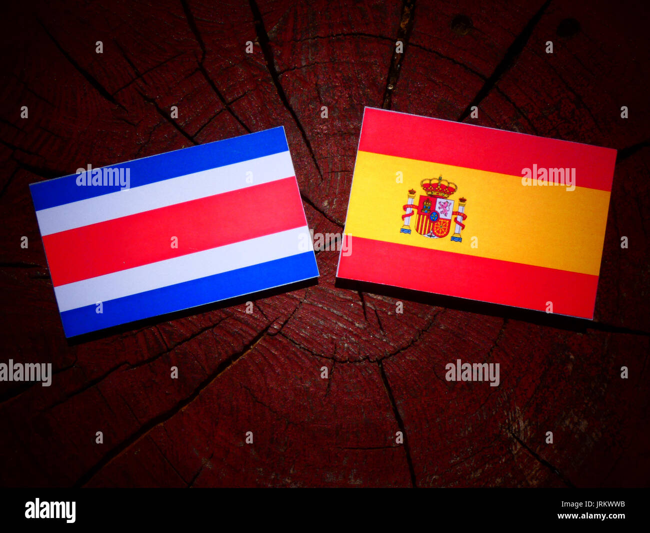 Costa Rican flag with Spanish flag on a tree stump isolated Stock Photo ...