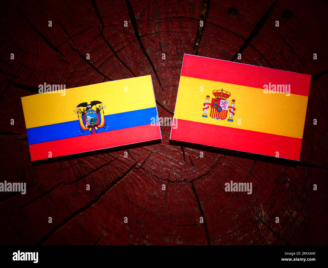 Ecuador flag with Spanish flag on a tree stump isolated Stock Photo - Alamy