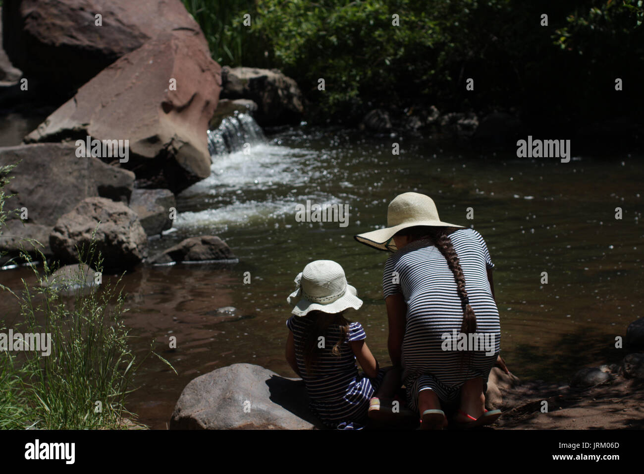 two girls playing in river water Stock Photo - Alamy