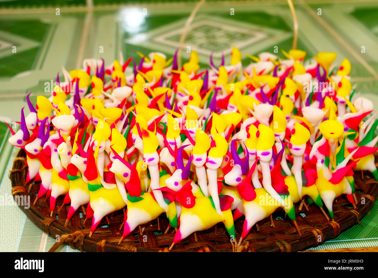 Tohe, the traditional toys in Vietnam made by colored rice powder Stock ...
