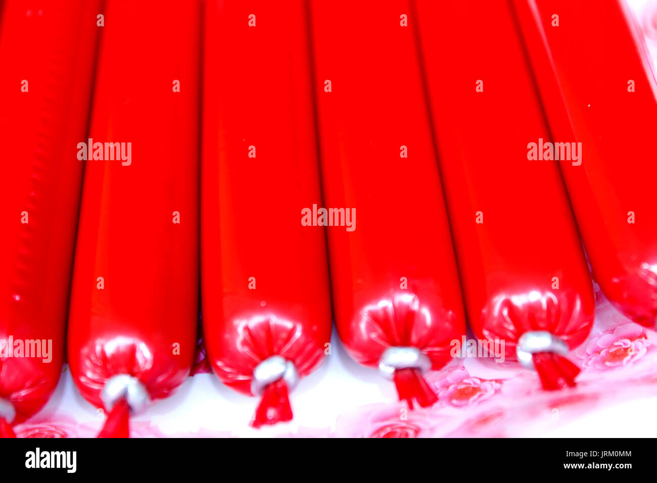 red sausage in pink plate Stock Photo - Alamy