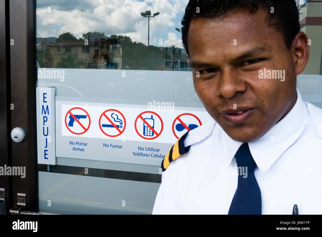 Security officer outside bank in Tegucigalpa, Honduras Stock Photo - Alamy