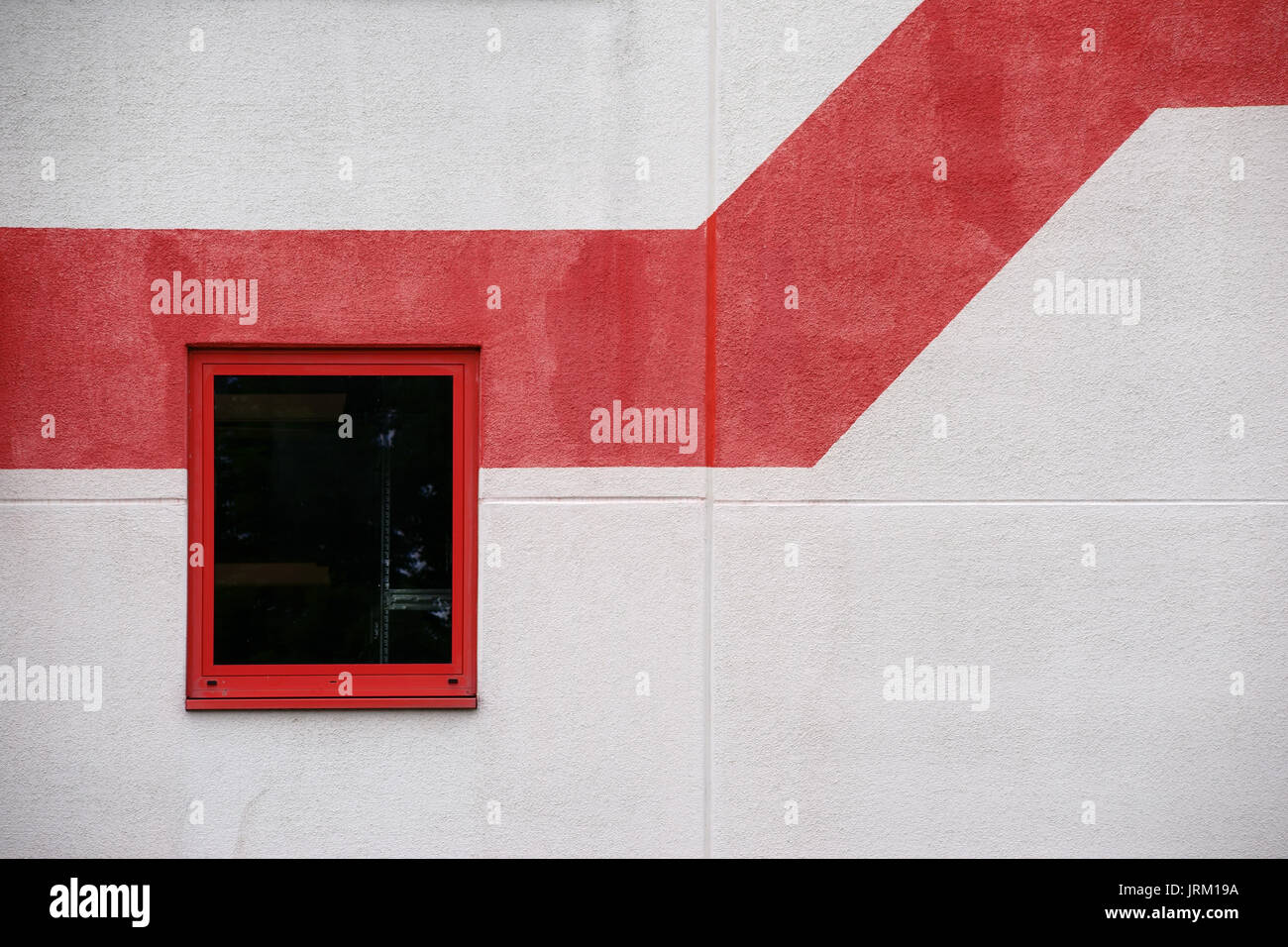 The window of a modern office building with a red zigzag decoration ...