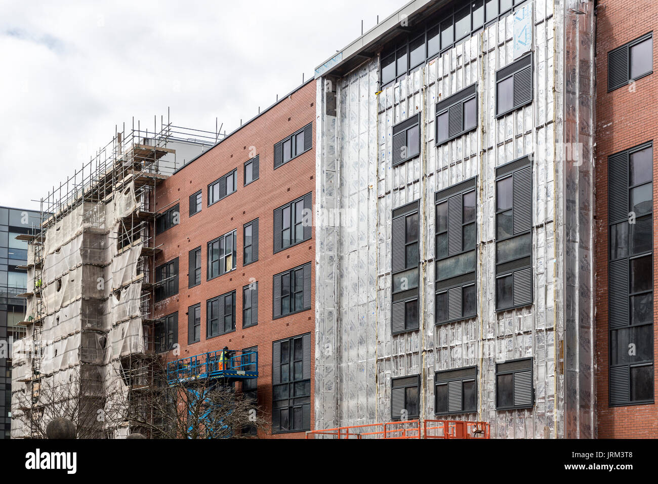 Cladding being installed on buildings, Cardiff, Wales, UK Stock Photo ...