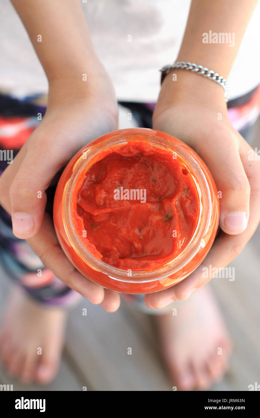 Tomato sauce bottle hand hi-res stock photography and images - Alamy