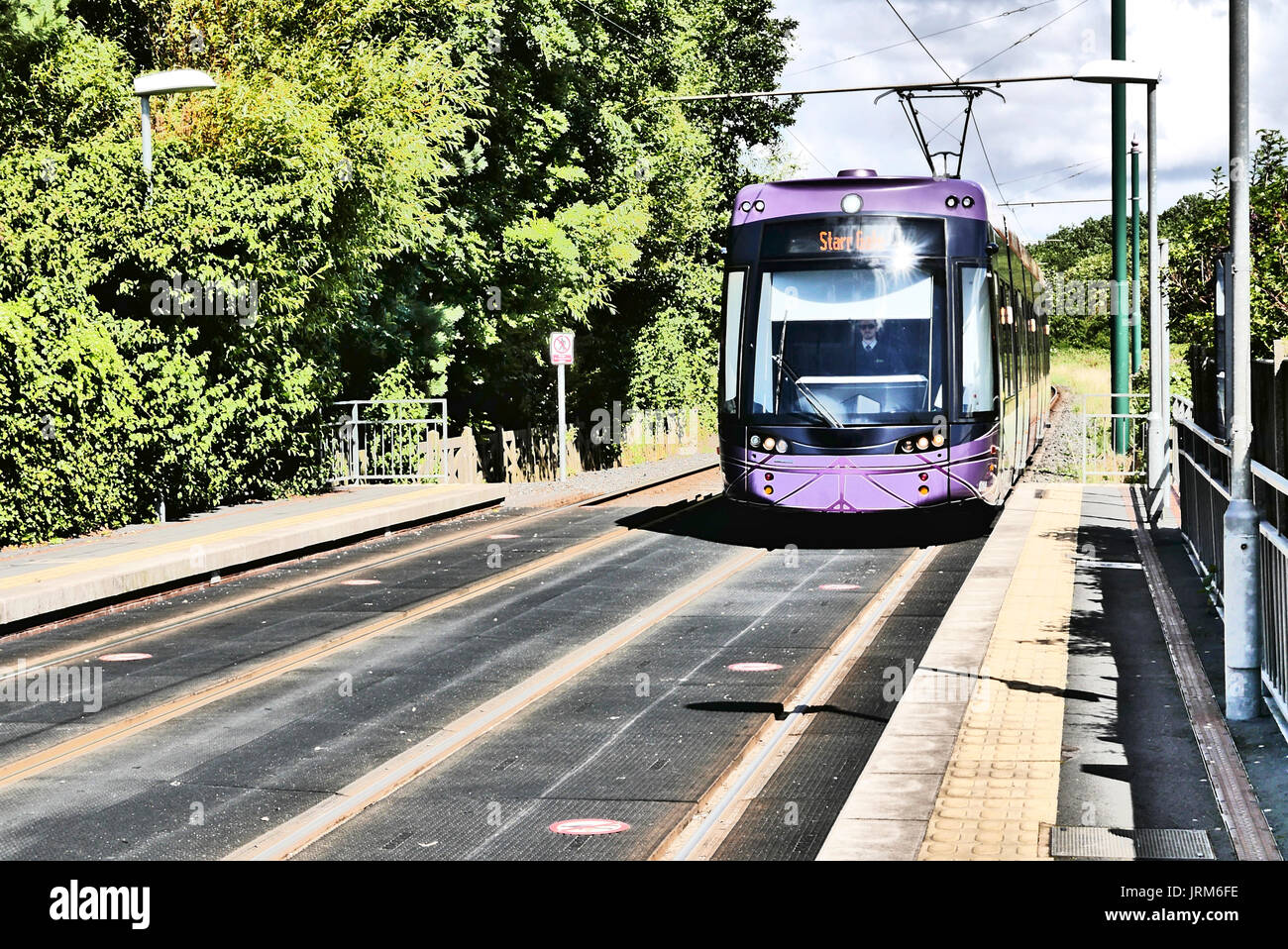 Blackpool tram arriving at tree lined tram stop in Fleetwood Stock ...