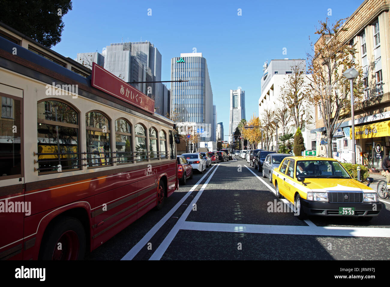 A busy street in Yokohama with a bus and taxi Stock Photo - Alamy