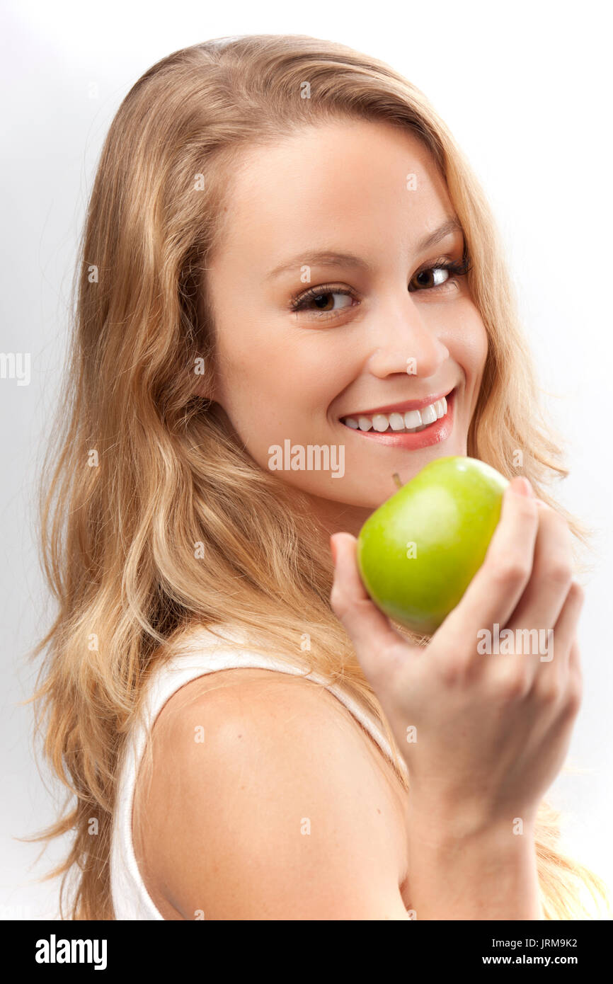 Young woman with apple Stock Photo - Alamy