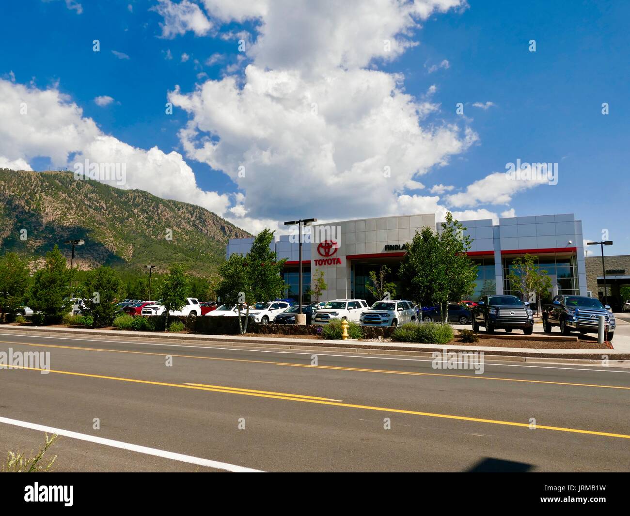 Toyota automobile and truck dealership next to Mt. Elden, with blue sky ...