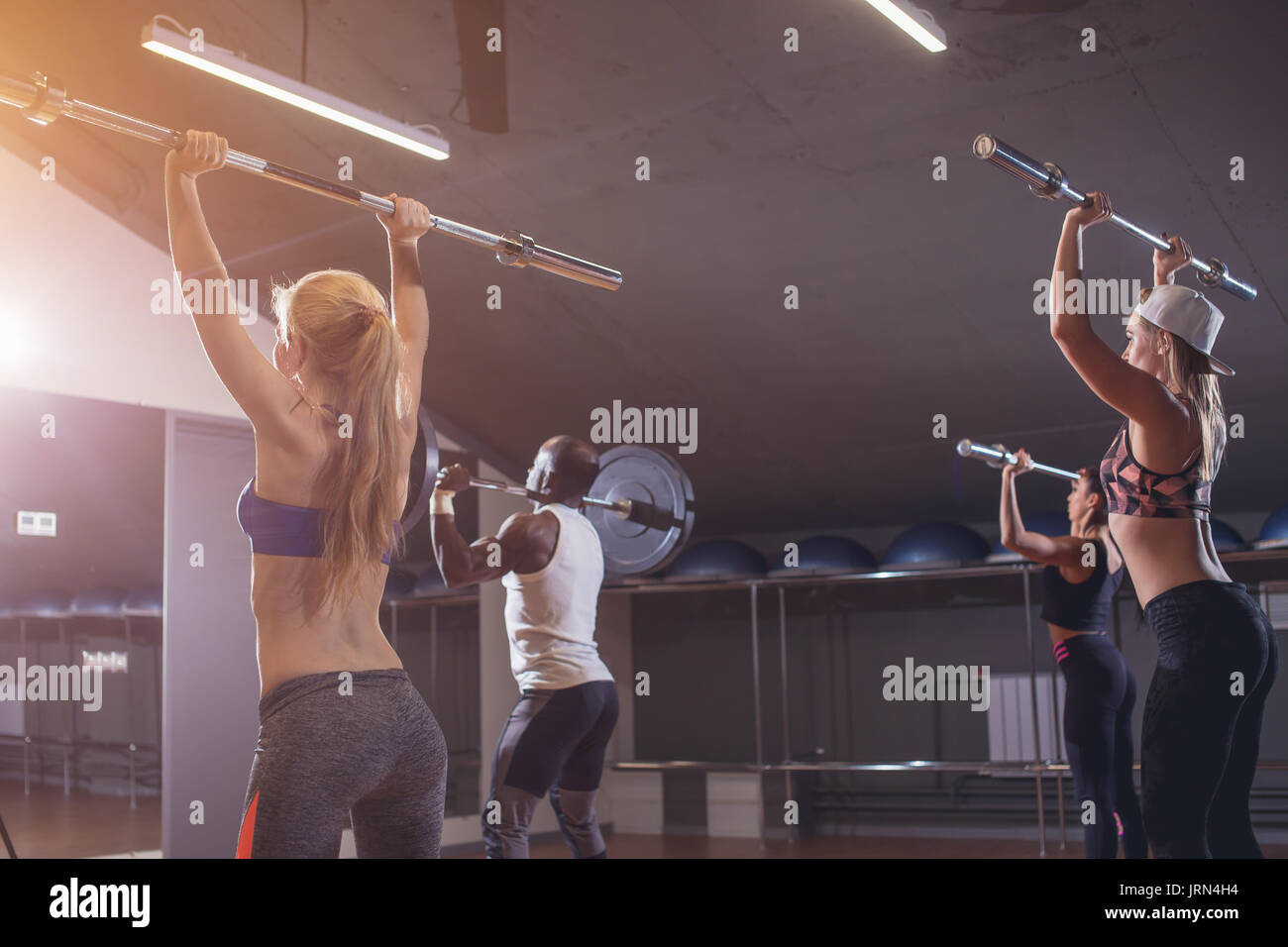 Barbell weight lifting group weightlifting workout exercise gym Stock ...