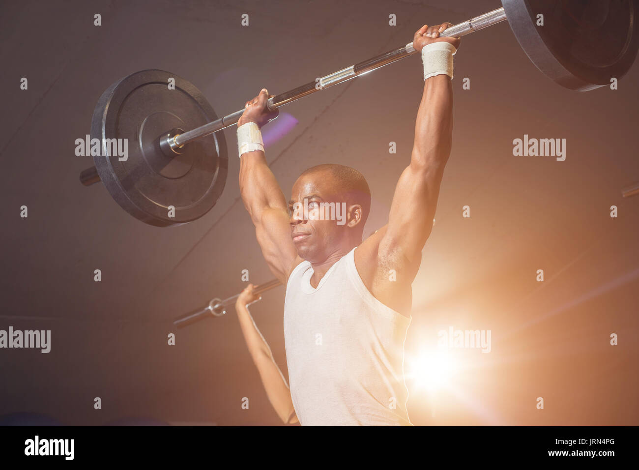 happy african man working out with barbell Stock Photo - Alamy