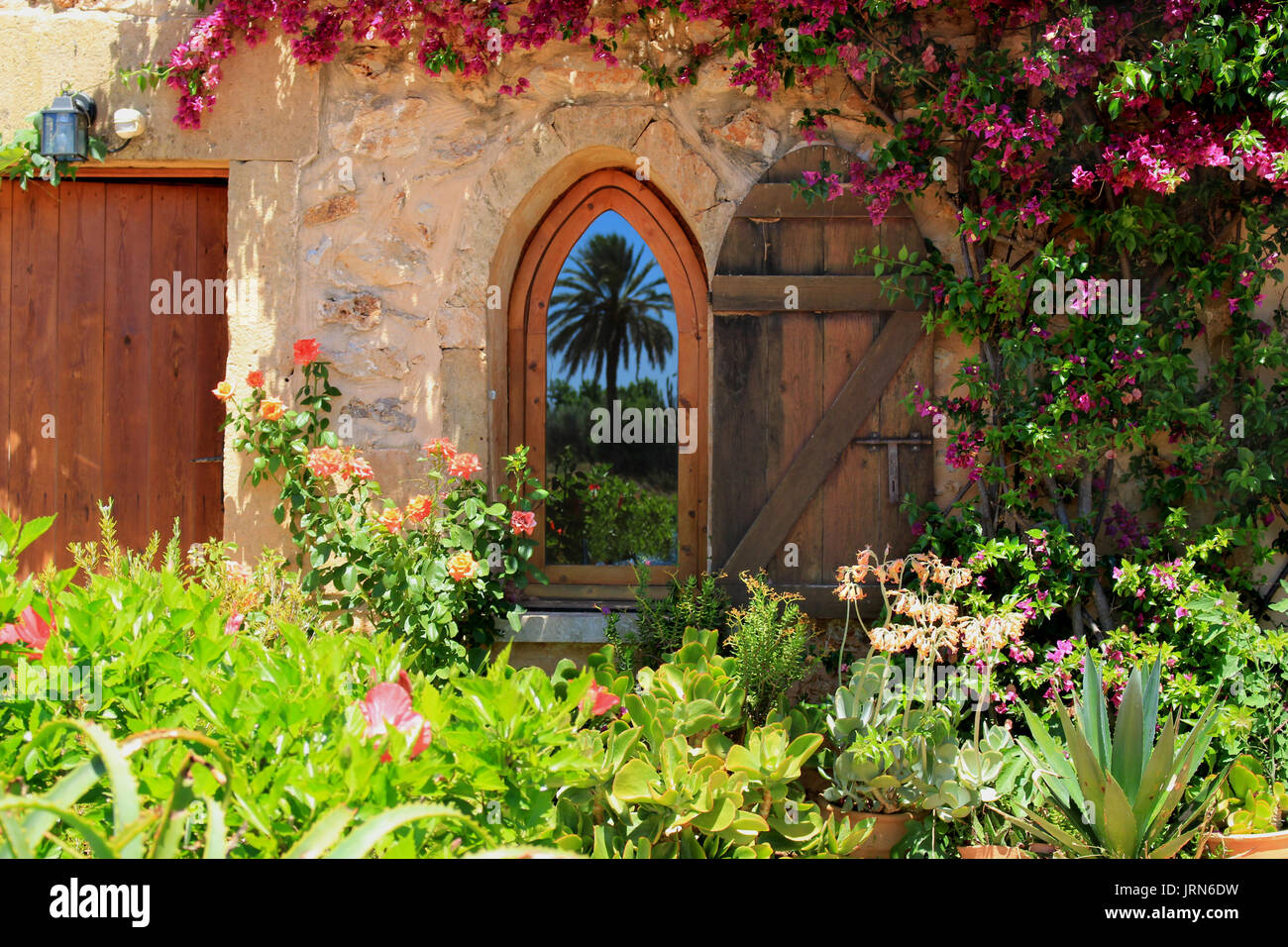 mediterranian farm with lush vegetation, Mallorca Stock Photo - Alamy