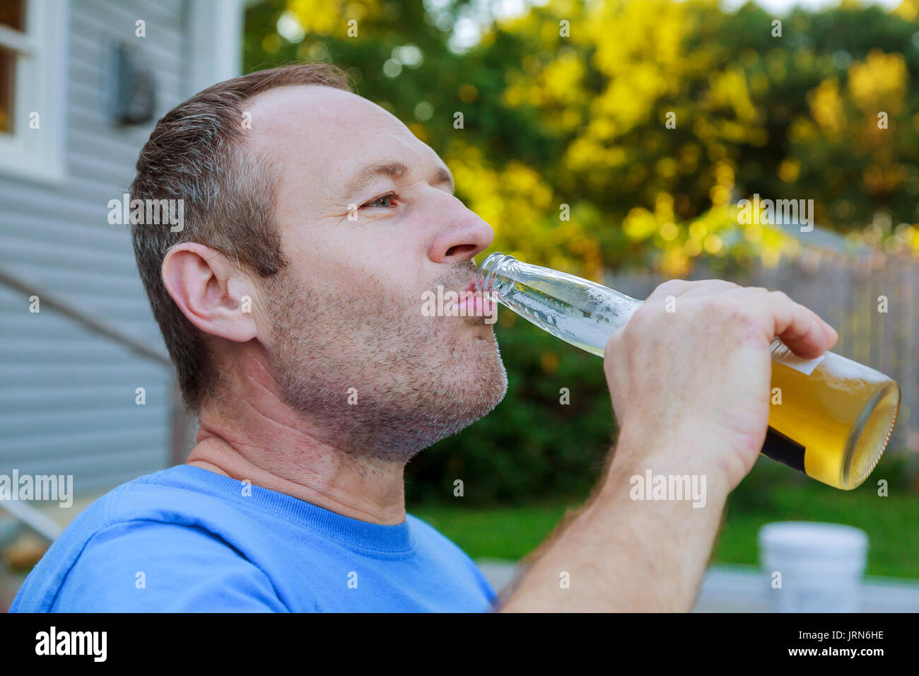 drinks, relax, leisure and people concept - close up of man drinking ...