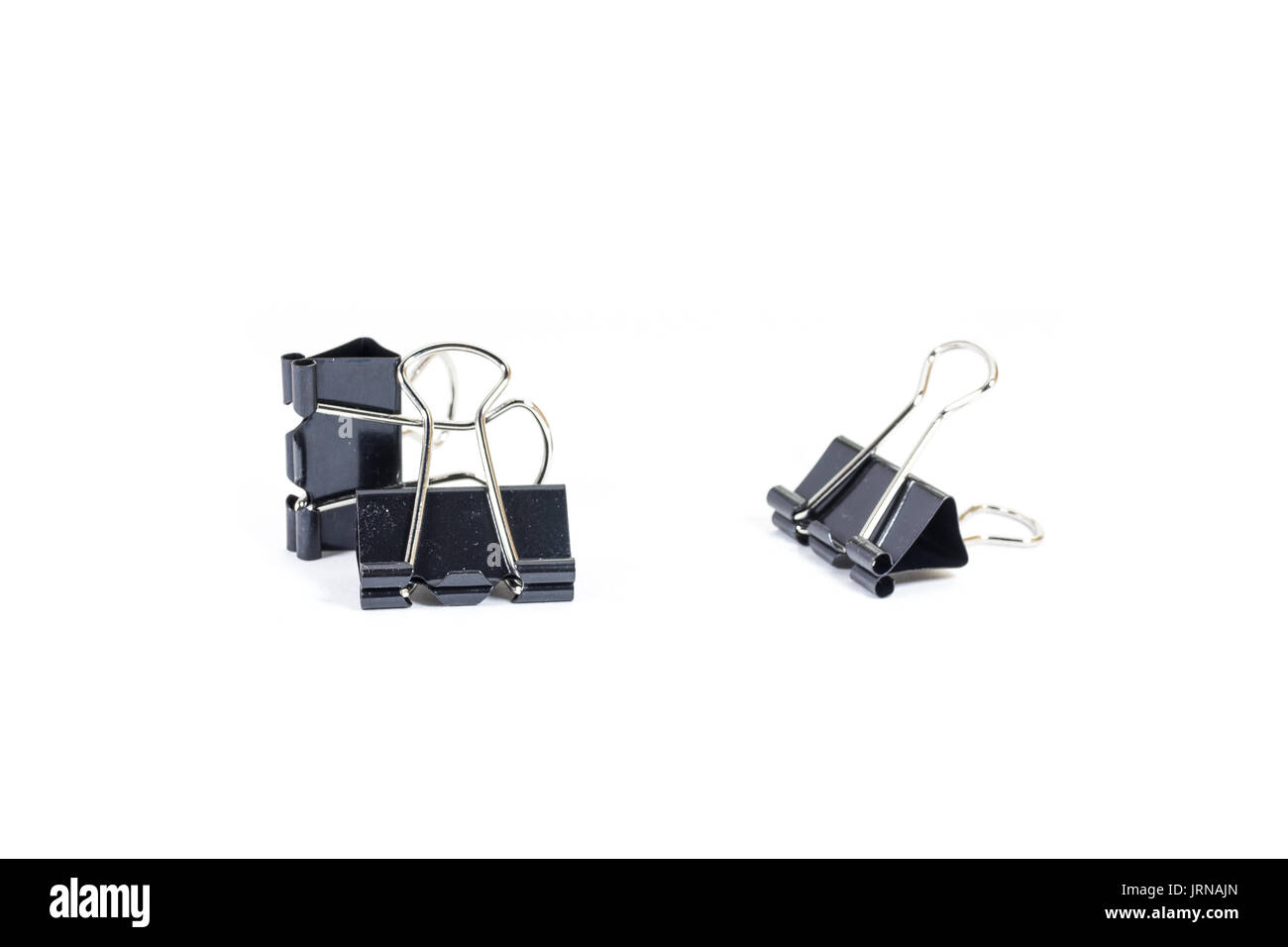 Black paper clips isolated in white background Stock Photo - Alamy