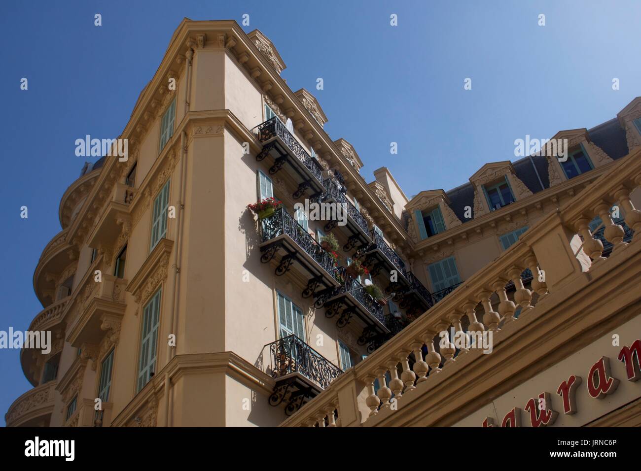 Low angle corner view of ornate building with balconies, Nice, France ...