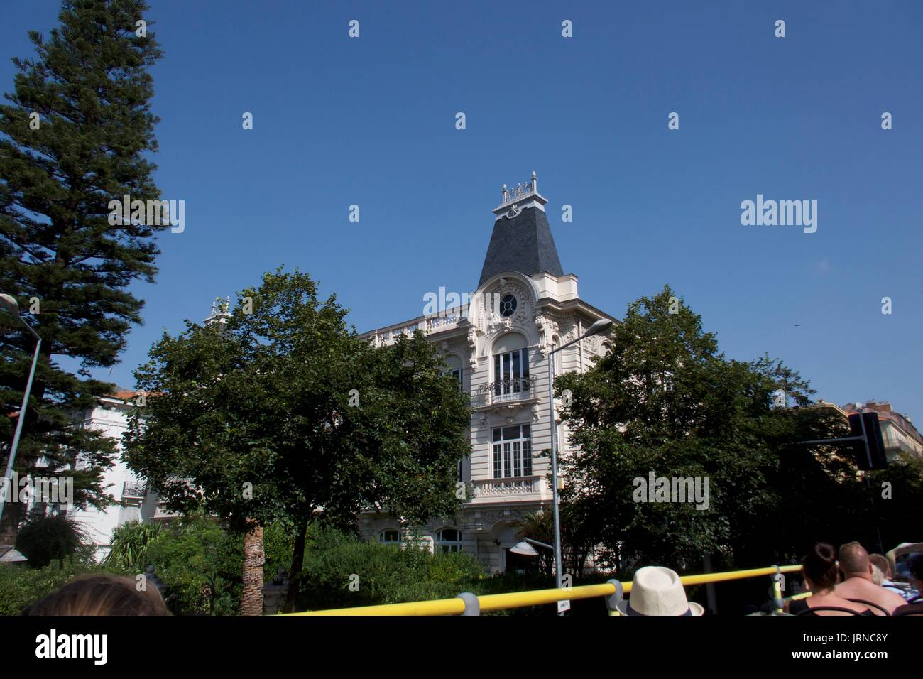 Tourists looking out from open top sightseeing bus, Nice, France Stock ...