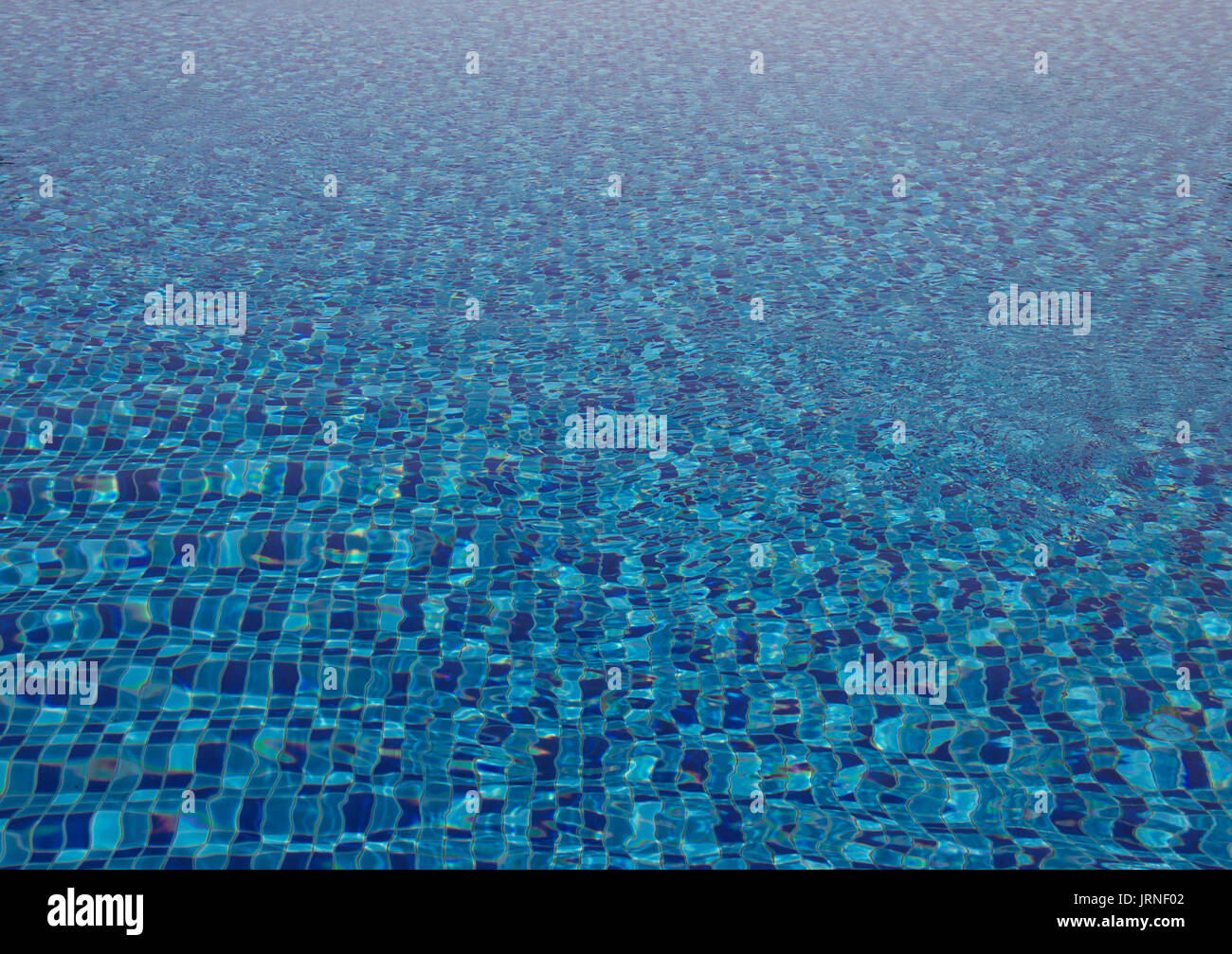 pool water surface ripples with checkered blue floor background Stock ...