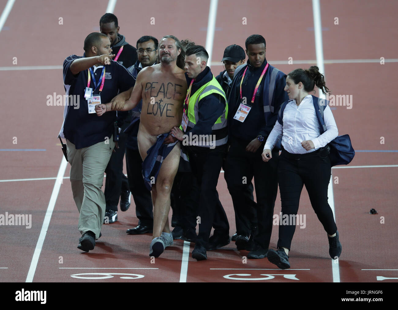 A streaker runs the track during day two of the 2017 IAAF World ...