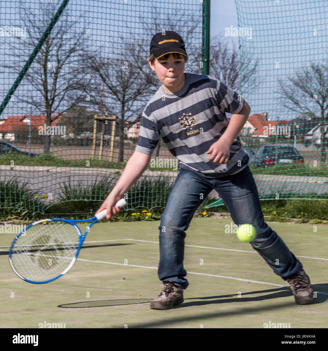 Teenager playing tennis hi-res stock photography and images - Alamy