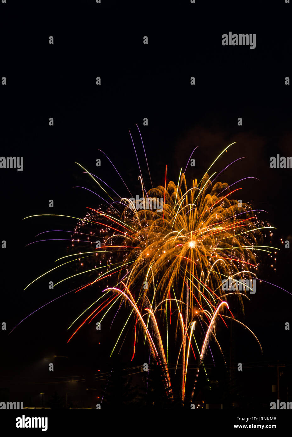 Bright fireworks display of varied colors during an evening of ...