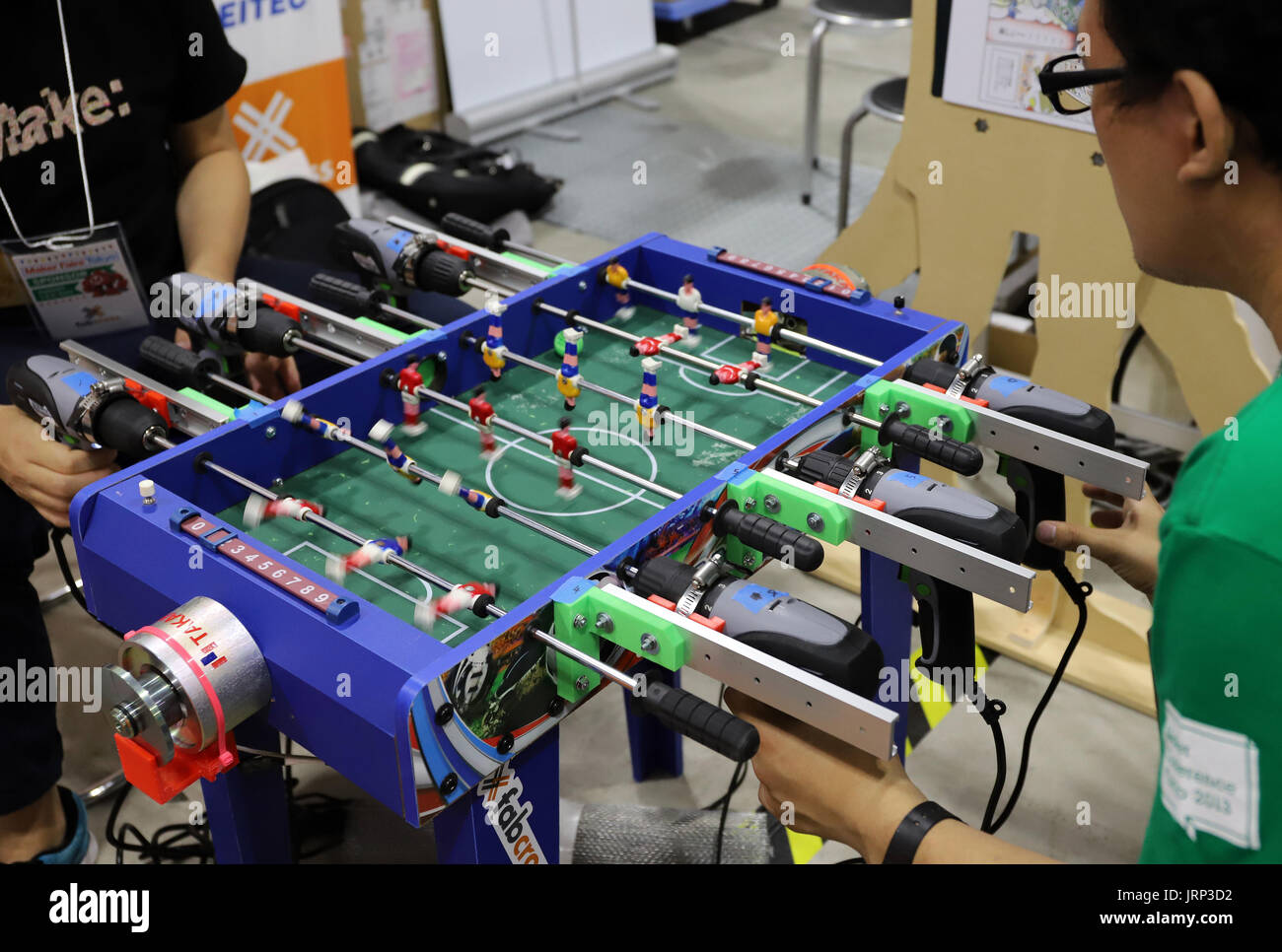 Tokyo, Japan. 5th Aug, 2017. Exhibitors demonstrate a table soccer game ...