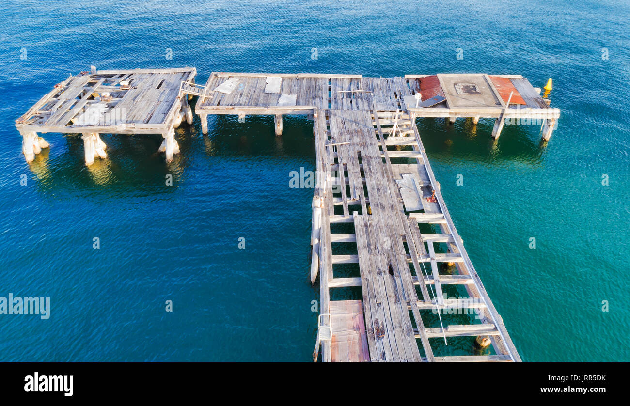 Old wooden jetty abandoned and out of service in the middle of Sydney ...